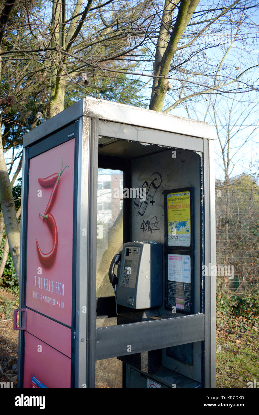 Vandalised telephone box. Smashed glass window. Damaged phone box ...