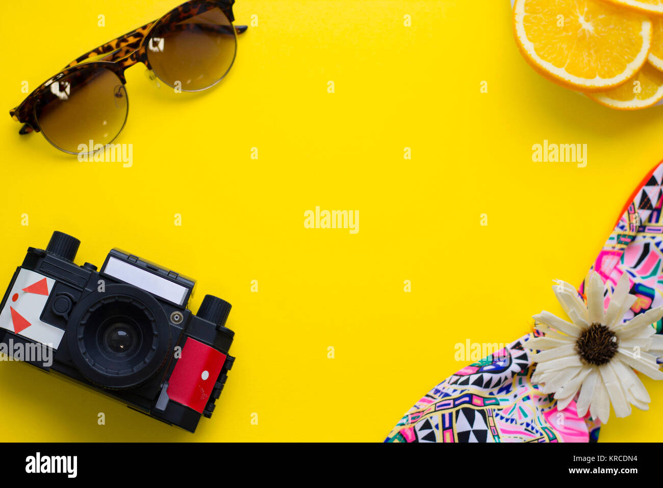 Bright yellow one-color background with a frame of tourist's ...