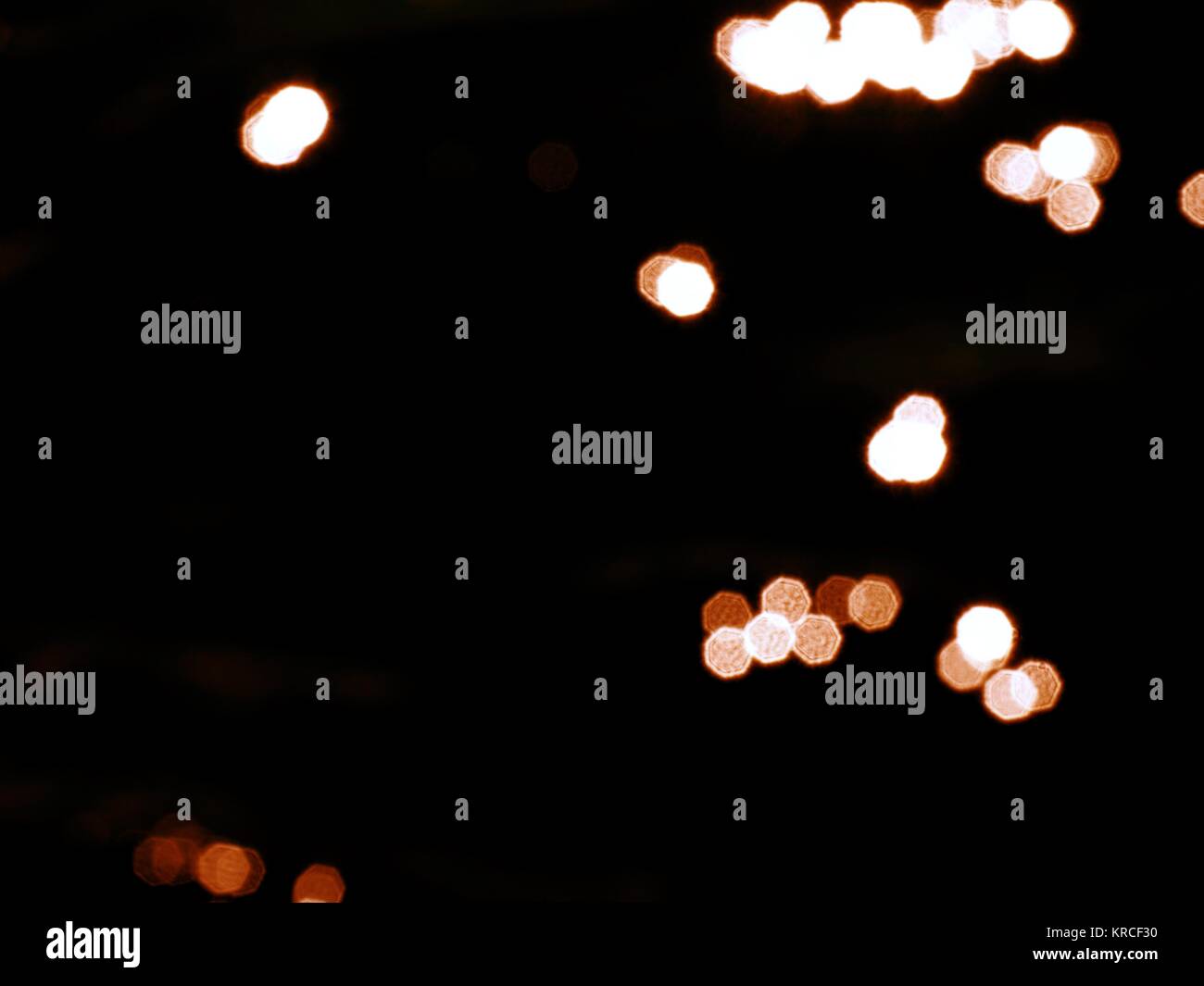 Defocused highlights on sunlit lake water. Colorful light reflection in ...