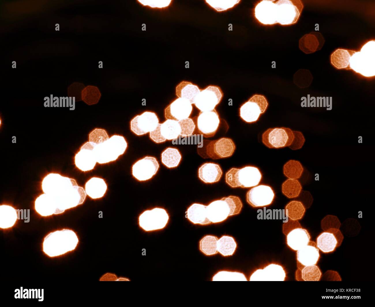 Defocused highlights on sunlit lake water. Colorful light reflection in ...