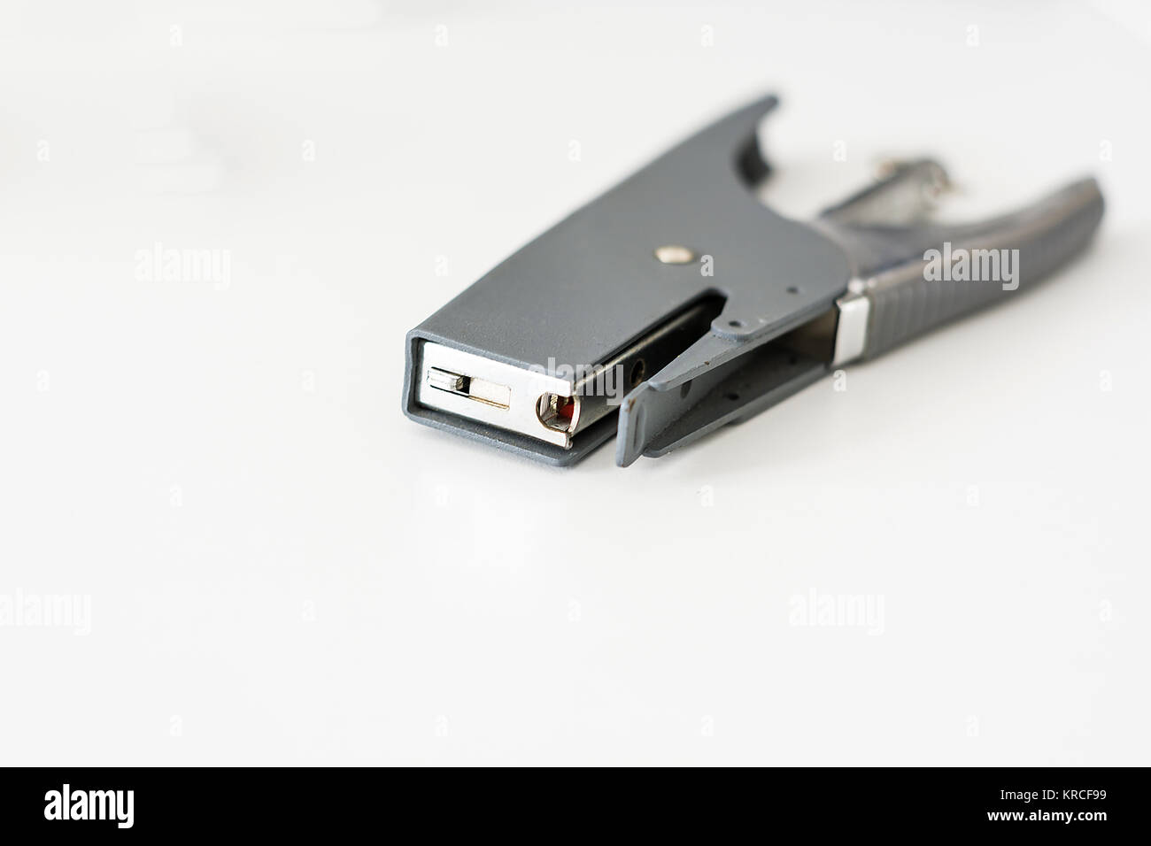 gray stapler on a white plain Stock Photo - Alamy