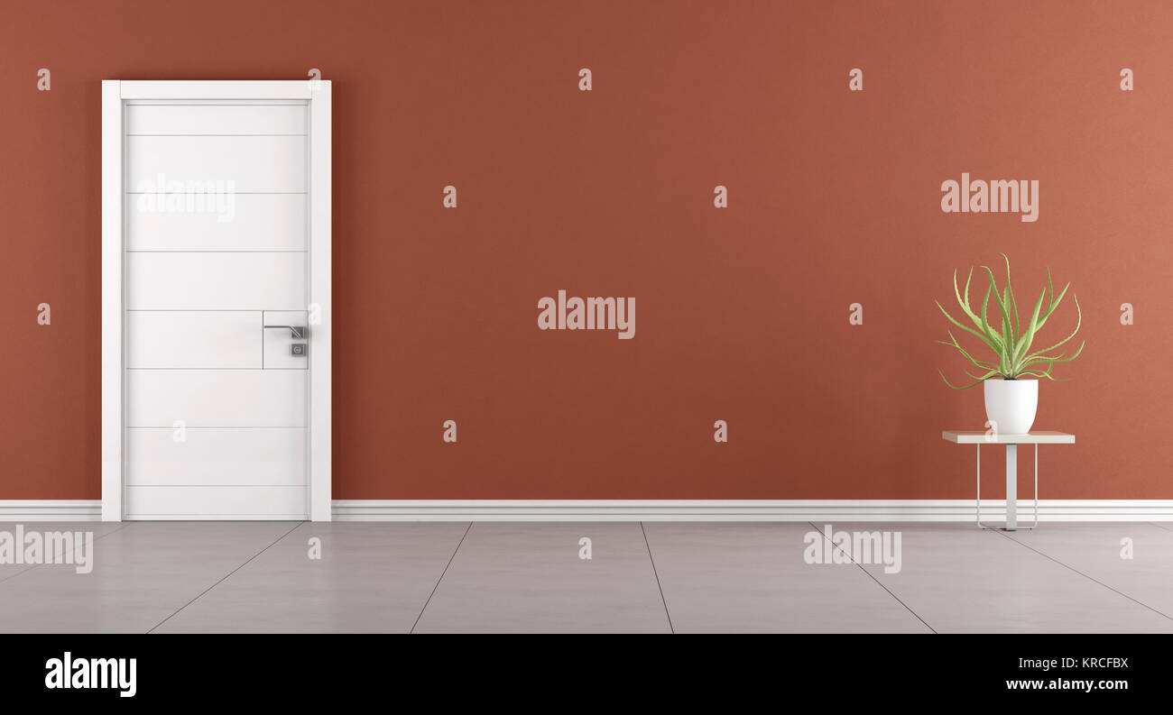 Modern room with closed door Stock Photo - Alamy