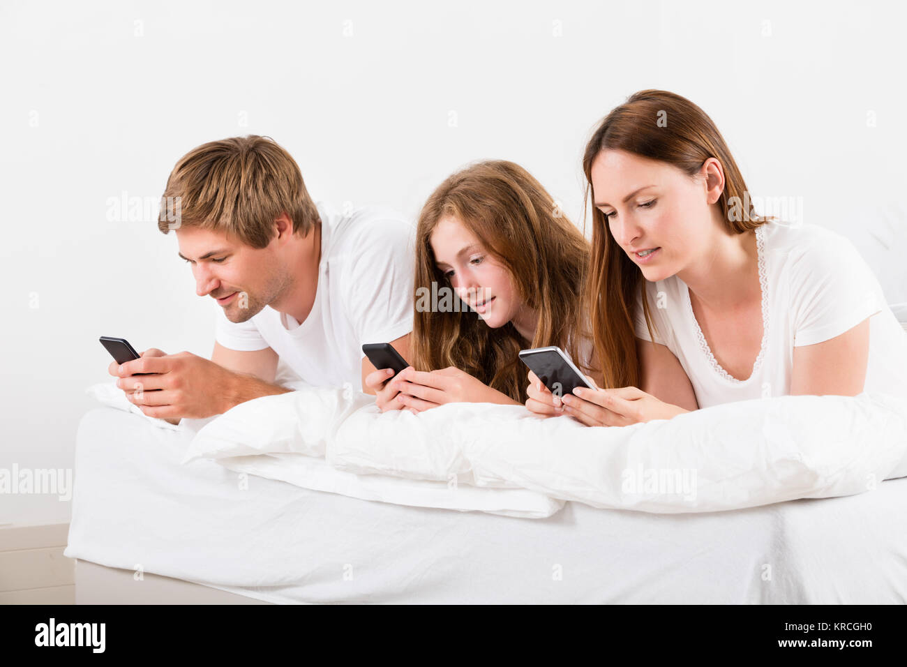 Family Using Mobile Phone Stock Photo - Alamy