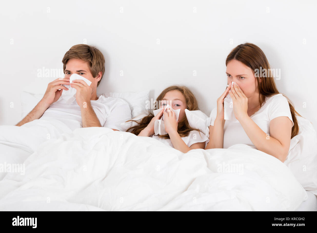 Family Suffering From Cold Stock Photo - Alamy