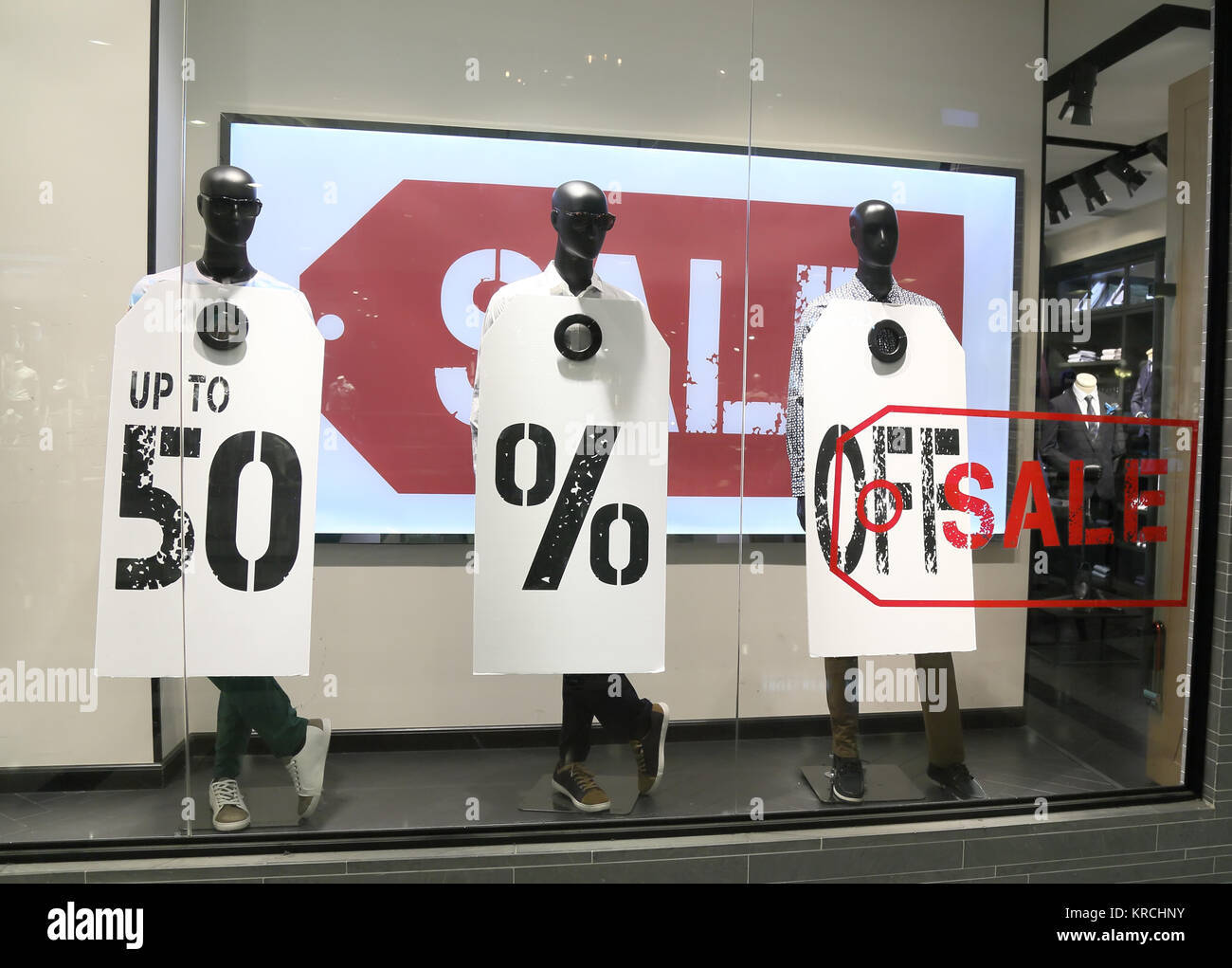 sale sign on shop display Stock Photo - Alamy