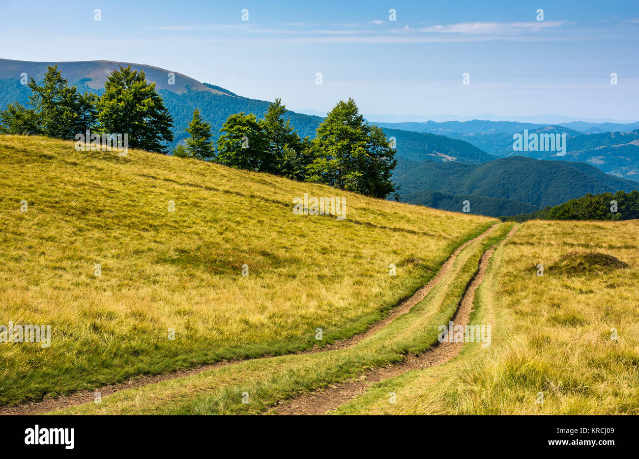 countryside road through grassy hill. rural transportation concept ...