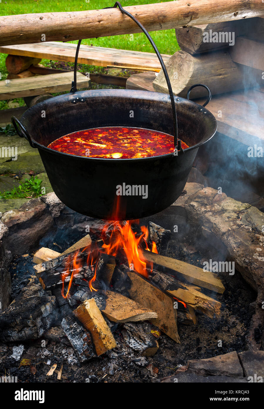 traditional Hungarian Goulash soup in cauldron. meal cooked outdoors on ...