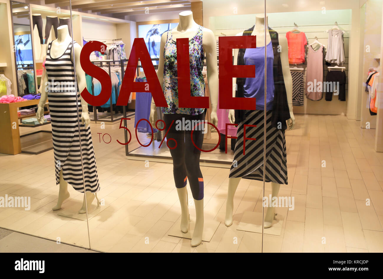 sale sign on shop display Stock Photo - Alamy