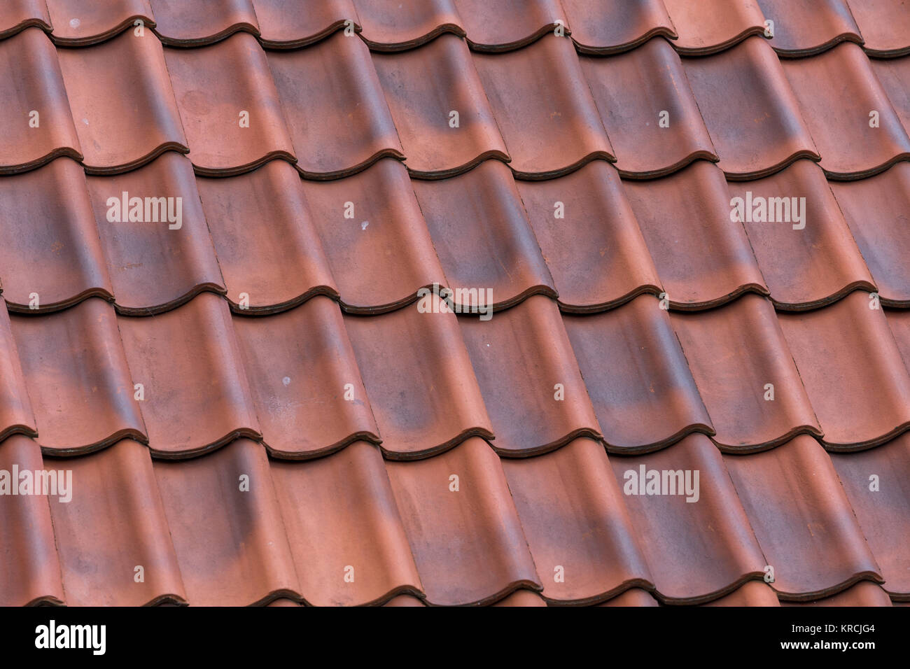 Red tiles roof background Stock Photo - Alamy