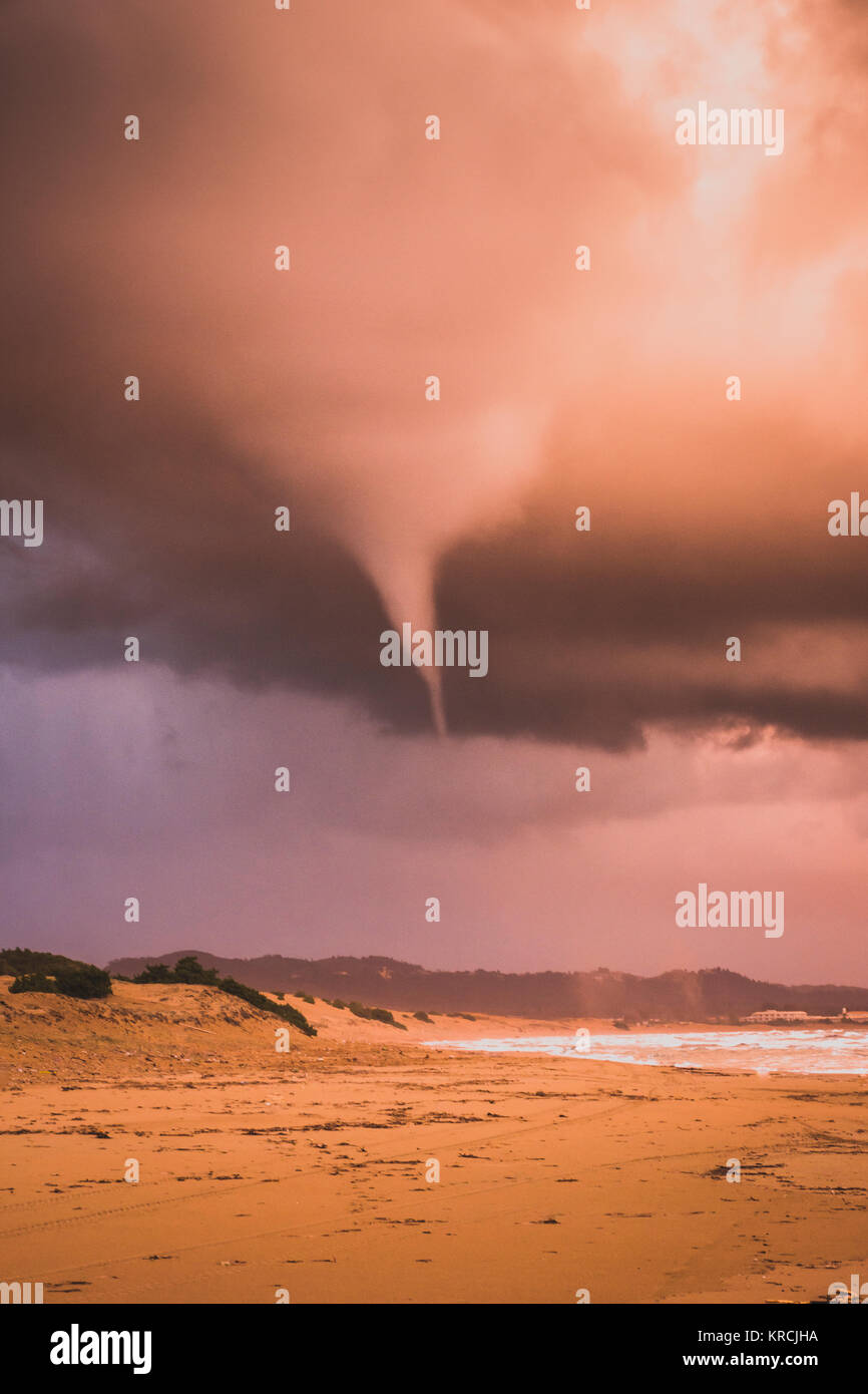 Mini sea twister developing on the beach Stock Photo - Alamy