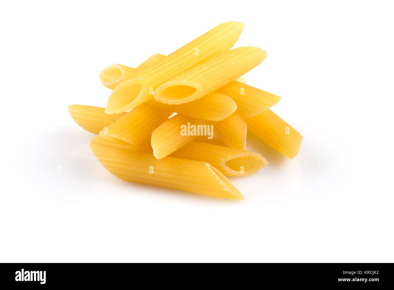 pile of penne on white background Stock Photo - Alamy