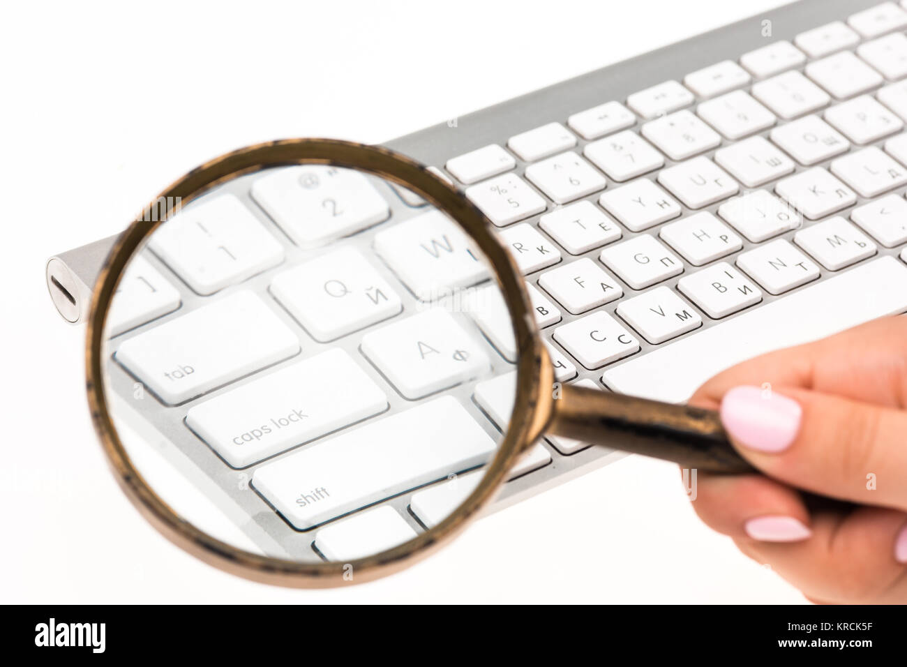 Laptop with a magnifying glass Stock Photo - Alamy