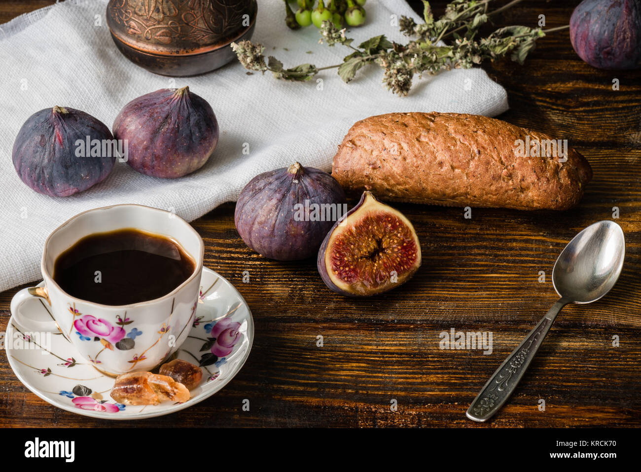 Cup of coffee with fresh bun and some figs Stock Photo - Alamy