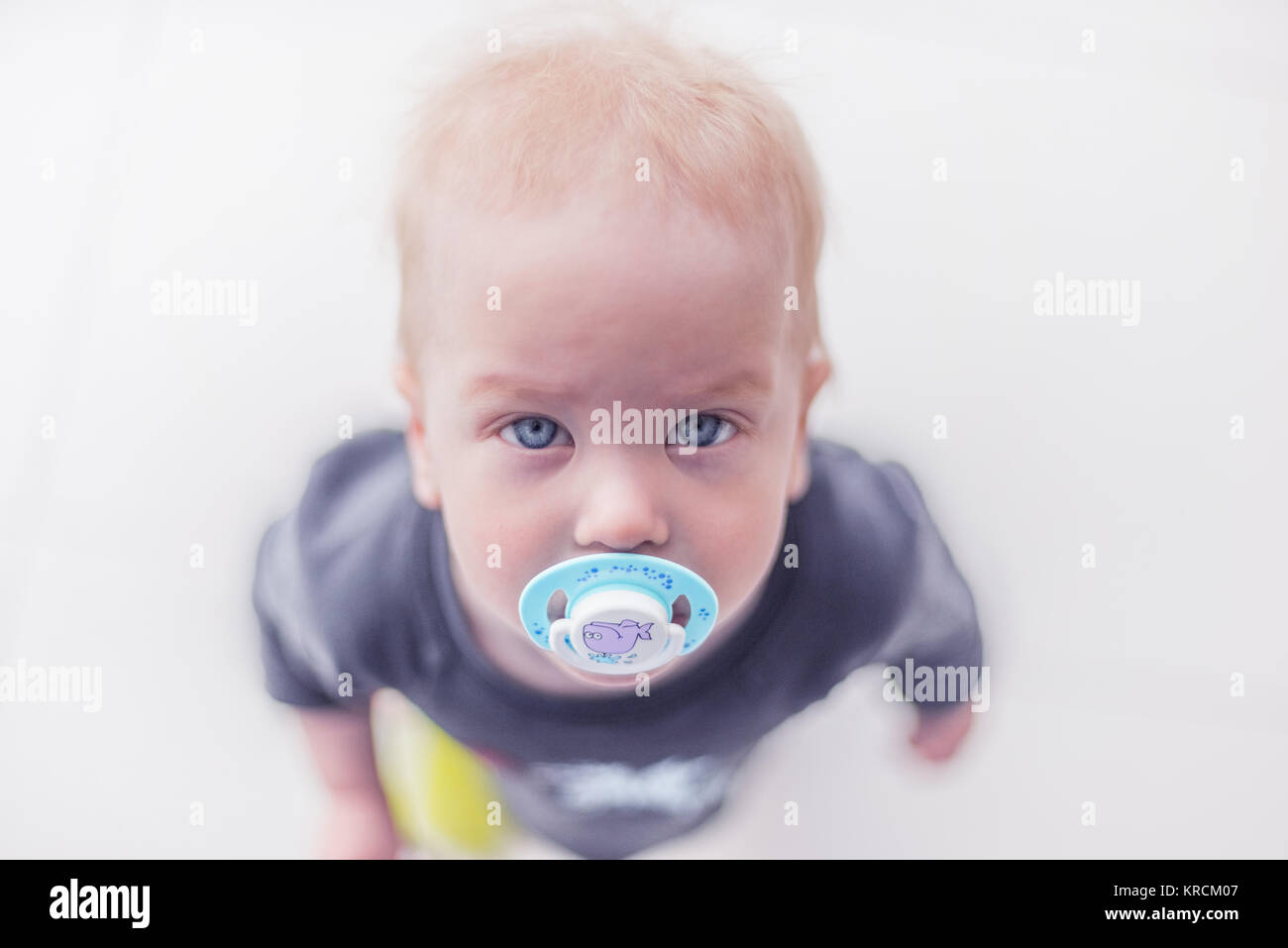 baby boy with pacifier isolated on a white background Stock Photo - Alamy