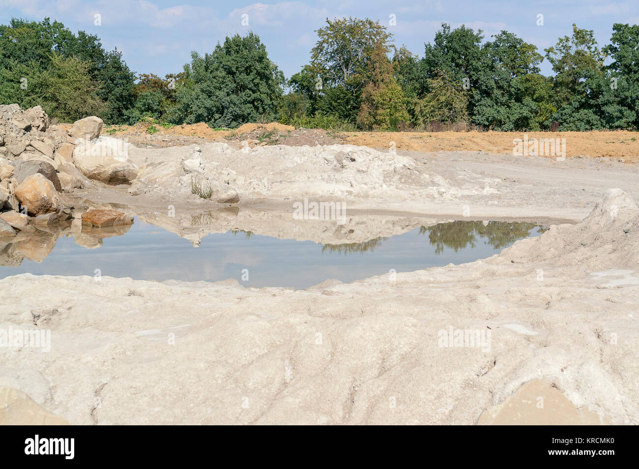small pond in a stone pit Stock Photo - Alamy