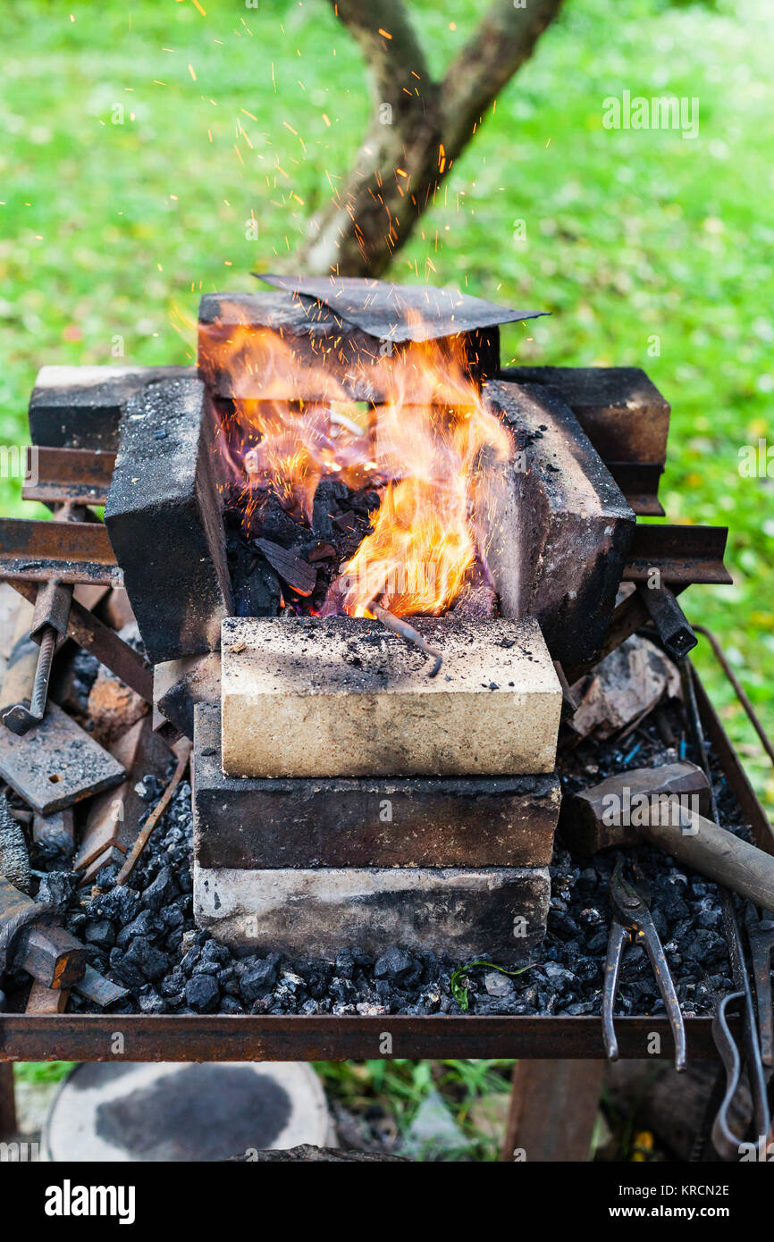 steel rod is heated in rural forging furnace Stock Photo - Alamy