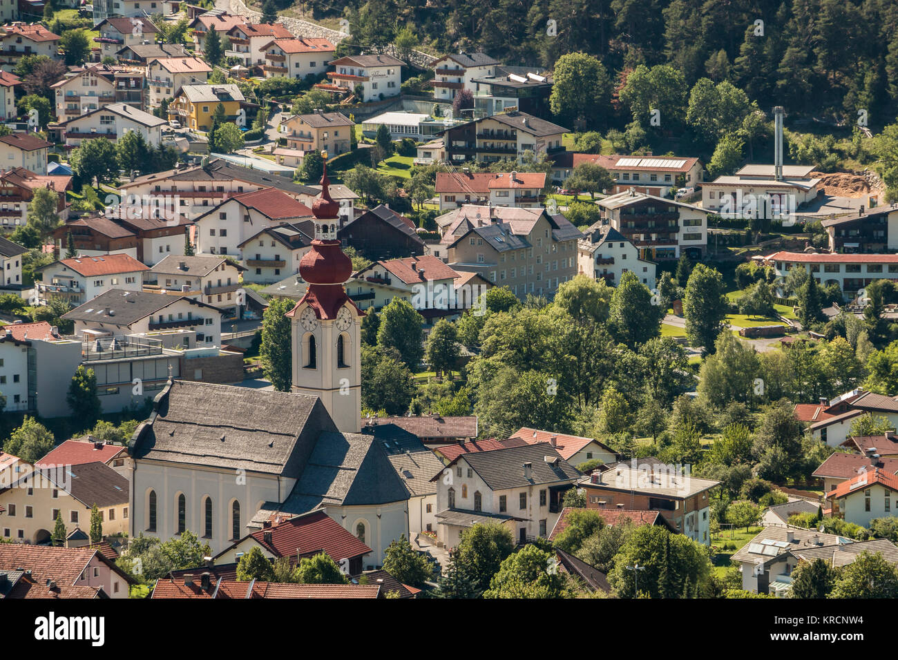 Little village, church and trees down the mountains Stock Photo - Alamy