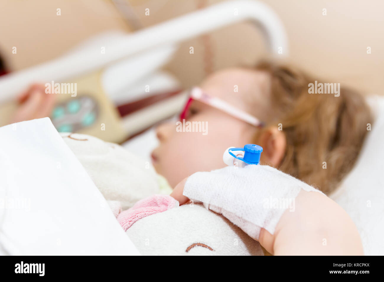 Little sick girl with catheter, infusion system attached with medical ...