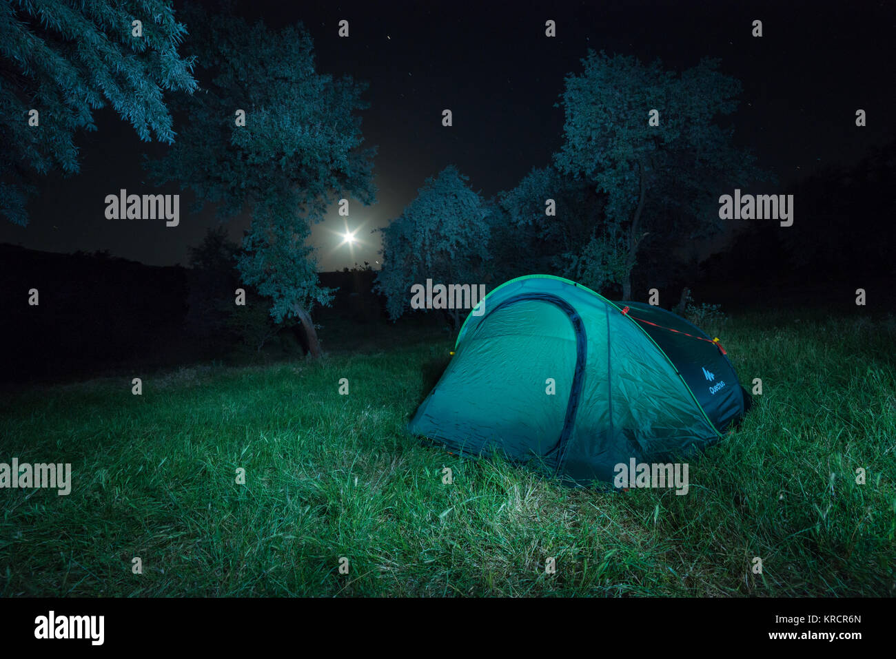Nightscape with camping tent and moon on black sky Stock Photo - Alamy