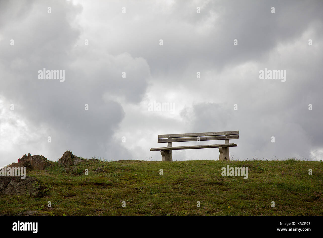 bench on top of rain clouds Stock Photo - Alamy