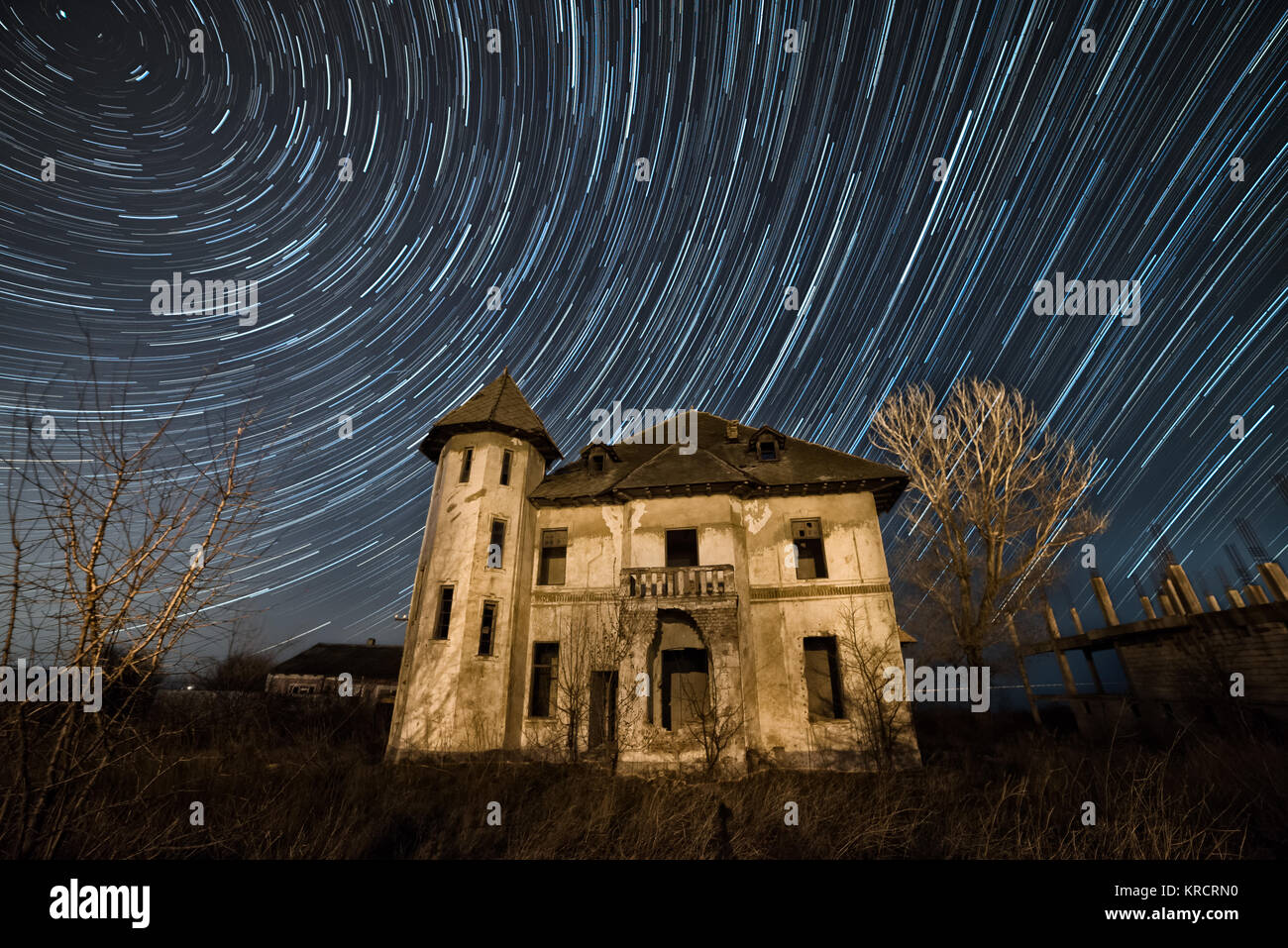 Star trails at old decay building. Romania Stock Photo - Alamy