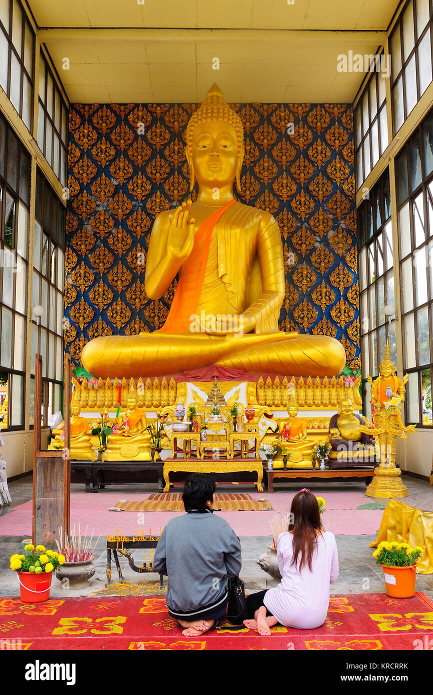 Buddhists are paying homage to the golden Buddha image Stock Photo - Alamy