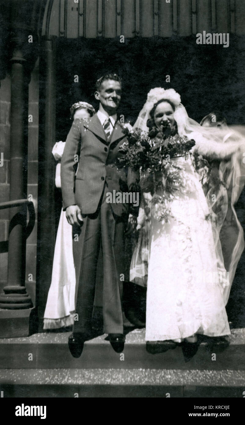 Newly married couple on church steps Stock Photo - Alamy