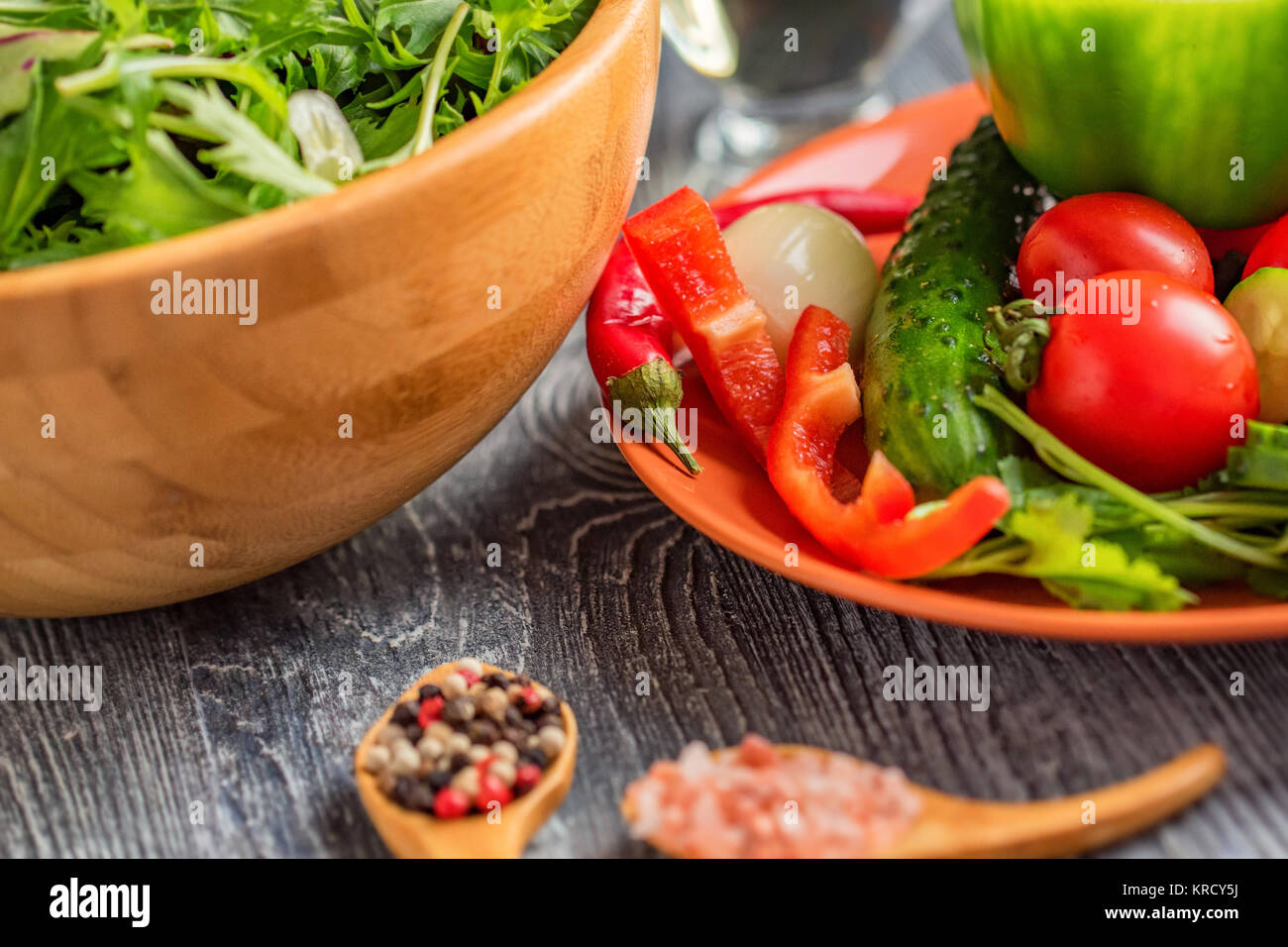 Fresh rustic vegetable salad on rustic background Stock Photo - Alamy