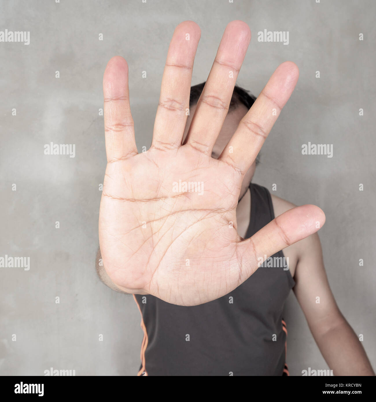 Man making stop gesture. Focus on a hand Stock Photo - Alamy