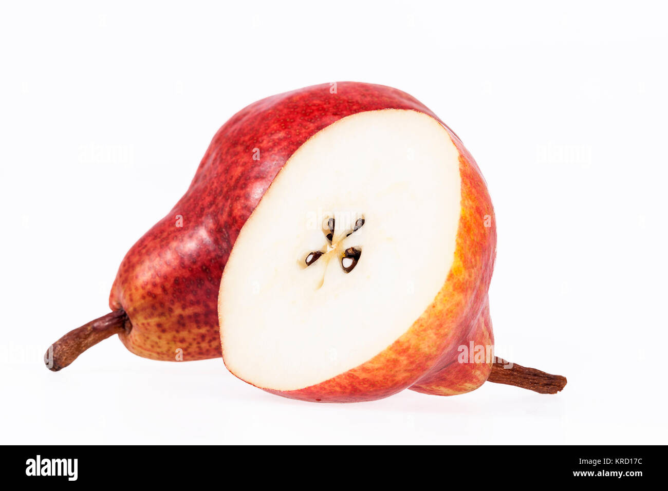 Two and half fruits of red pear isolated on white background Stock ...