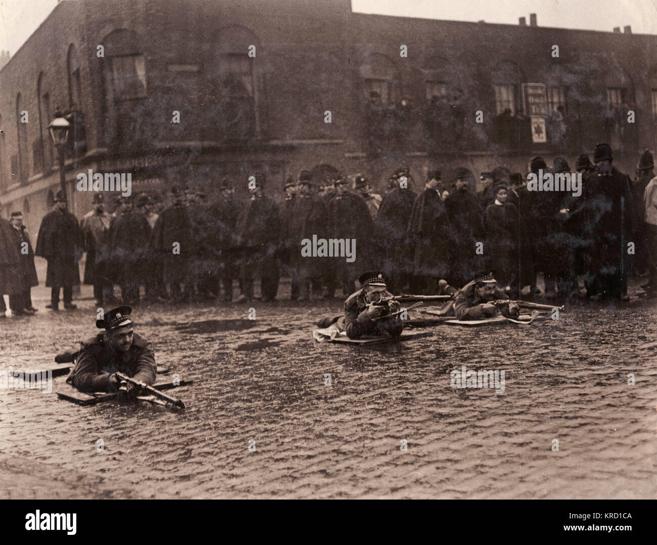 Guards take aim in Sidney Street, East London Stock Photo - Alamy