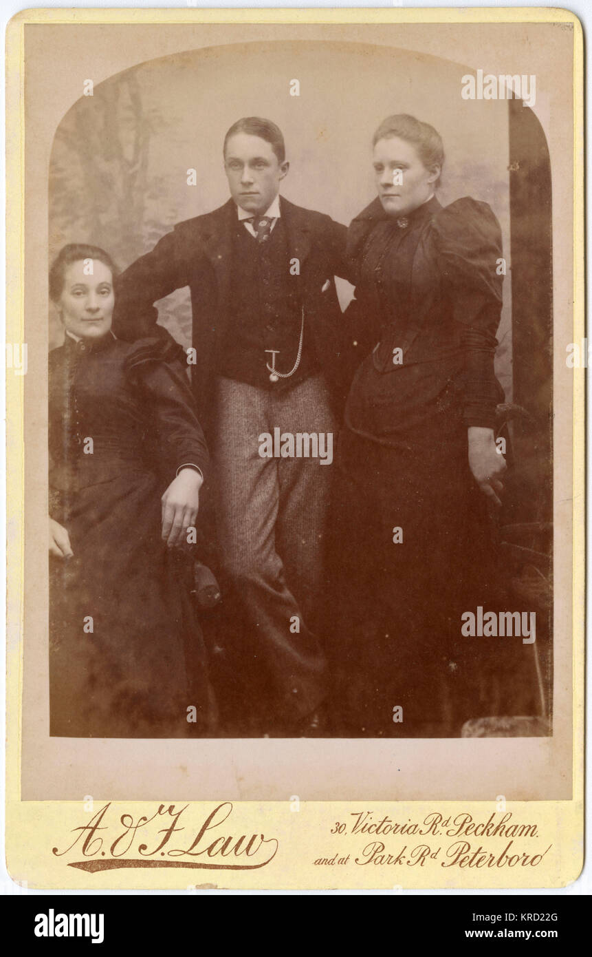 Two Victorian sisters and their brother in studio setting Stock Photo ...