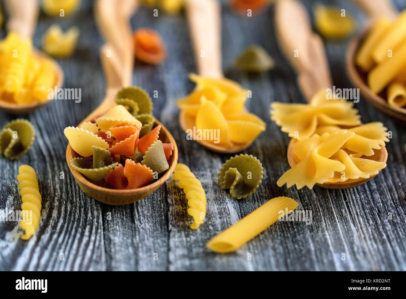 Various mix of pasta on wooden rustic background Stock Photo - Alamy