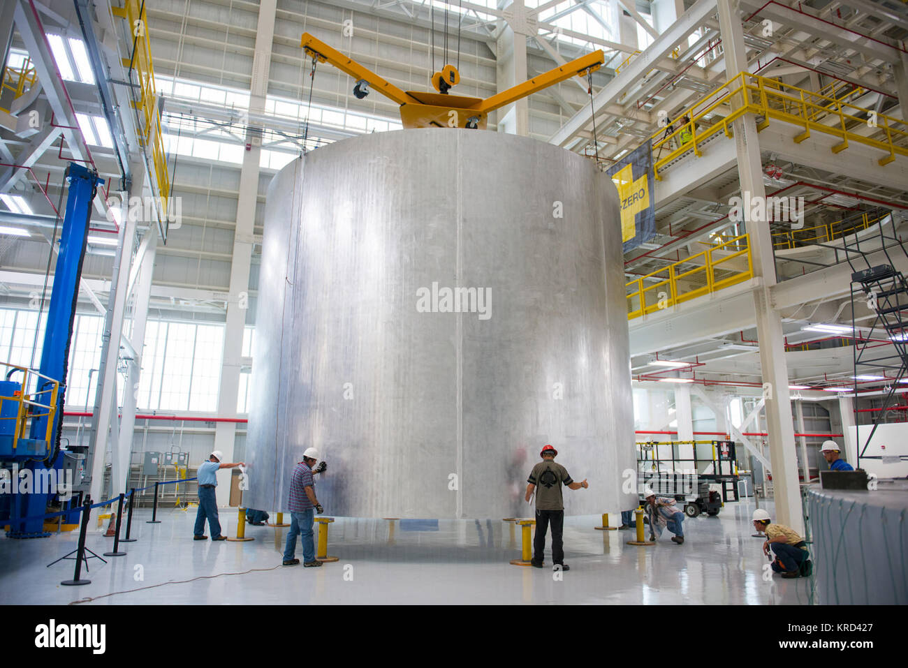 Workers at the Michoud Assembly Facility remove the first finished SLS ...