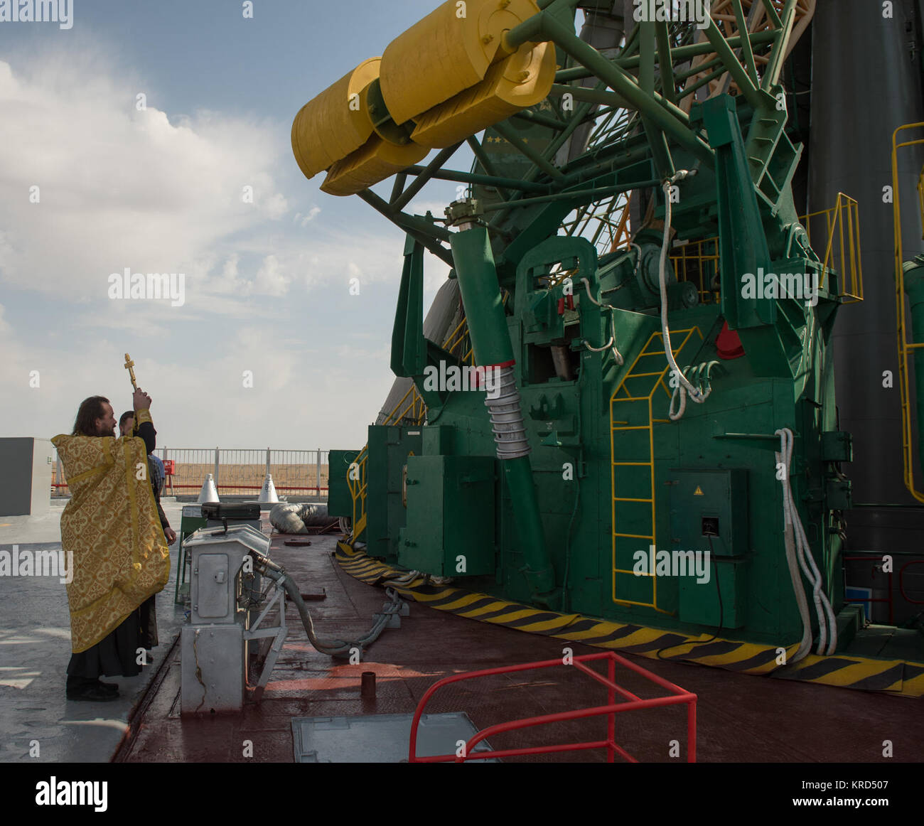 An Orthodox priest blesses the Soyuz rocket at the Baikonur Cosmodrome ...