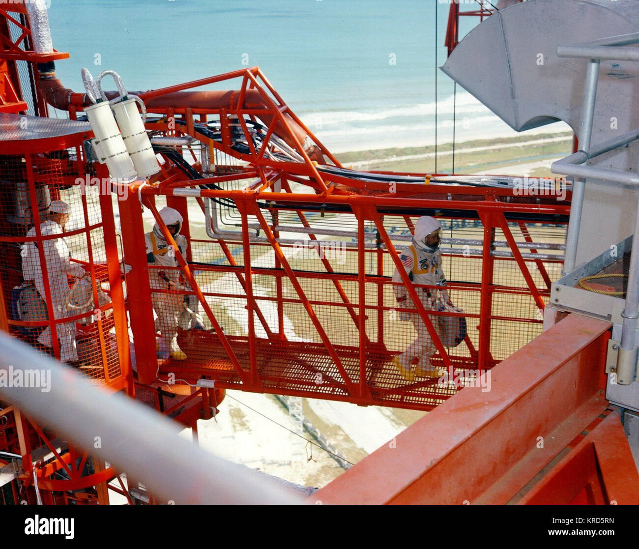 Apollo 1 crew crosses access arm Stock Photo - Alamy