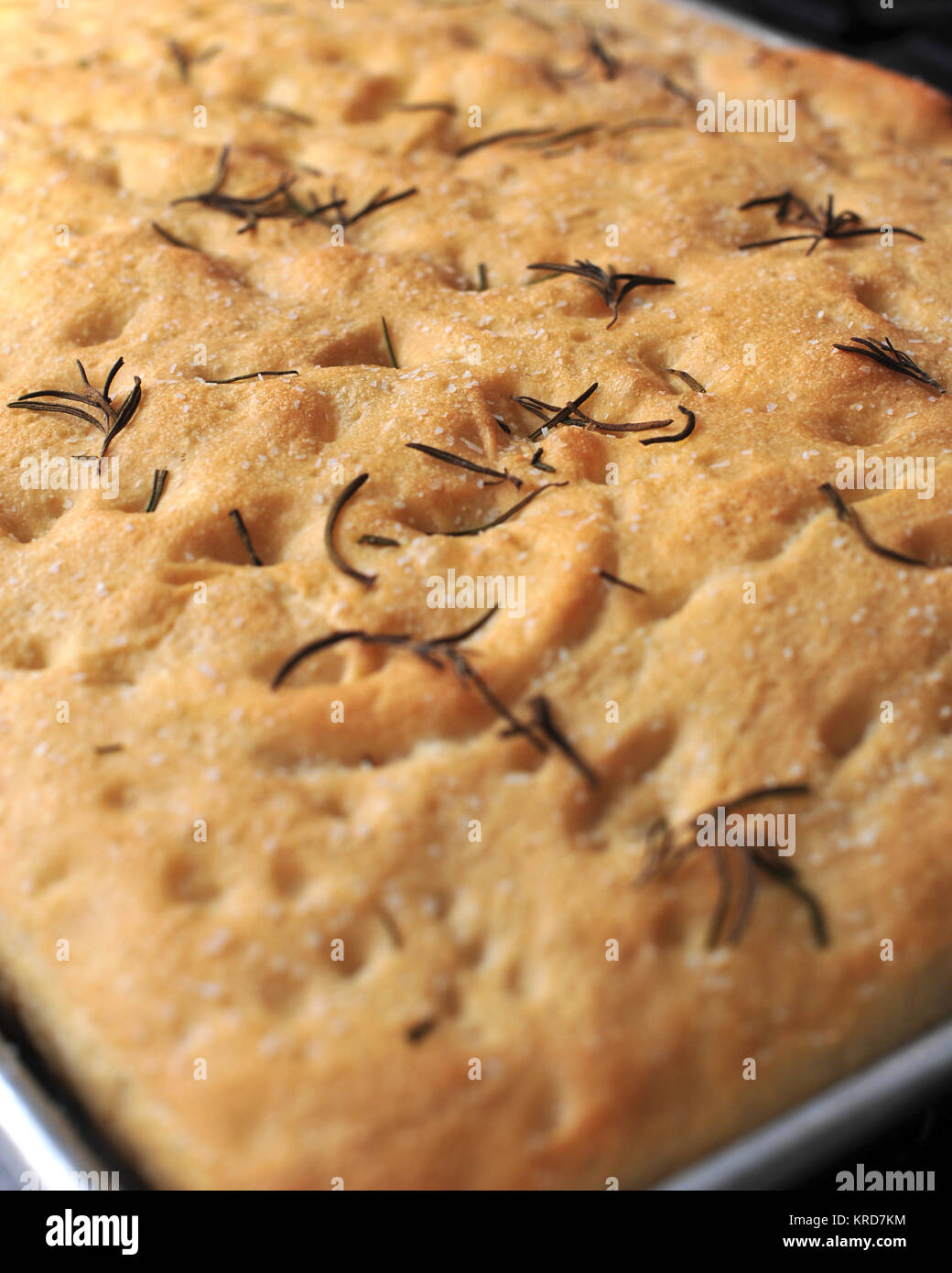 Focaccia on baking tray Stock Photo - Alamy