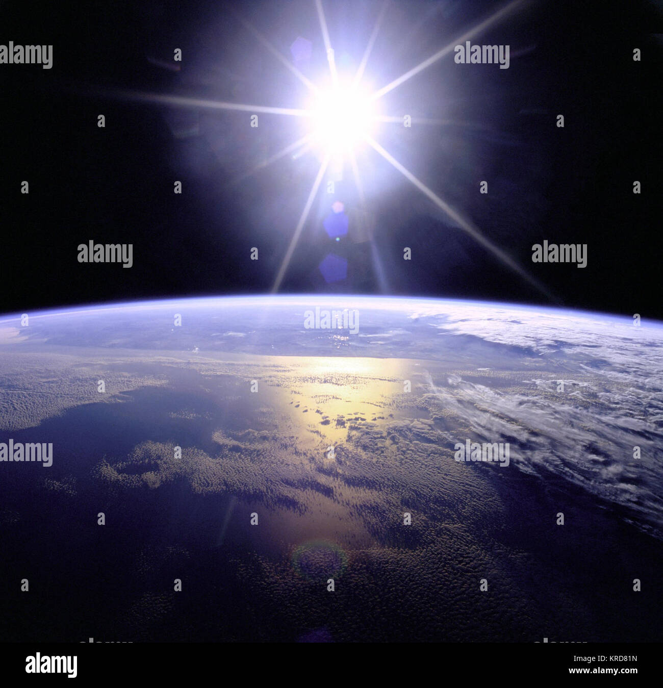 Full Sunburst over Earth Stock Photo - Alamy