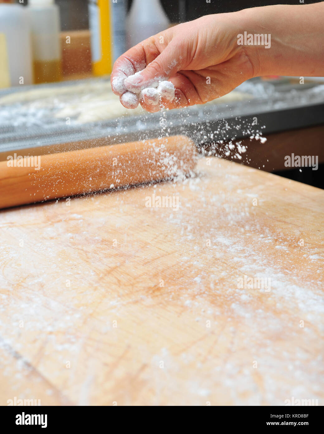 Bread making flour onto cutting board Stock Photo - Alamy