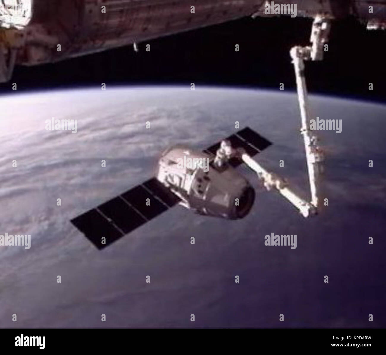 NASA TV C22B Dragon grappled Stock Photo - Alamy