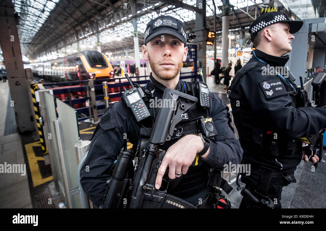 Armed British Transport Police officers on patrol in Manchester ...