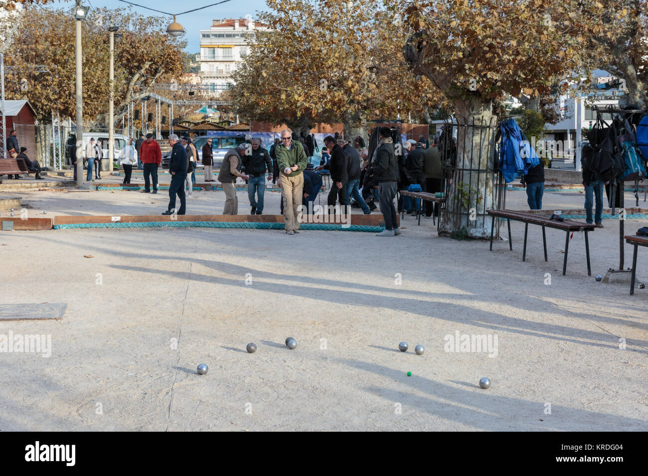 Group of men playing boules, or pétanque, a typical French ball game ...