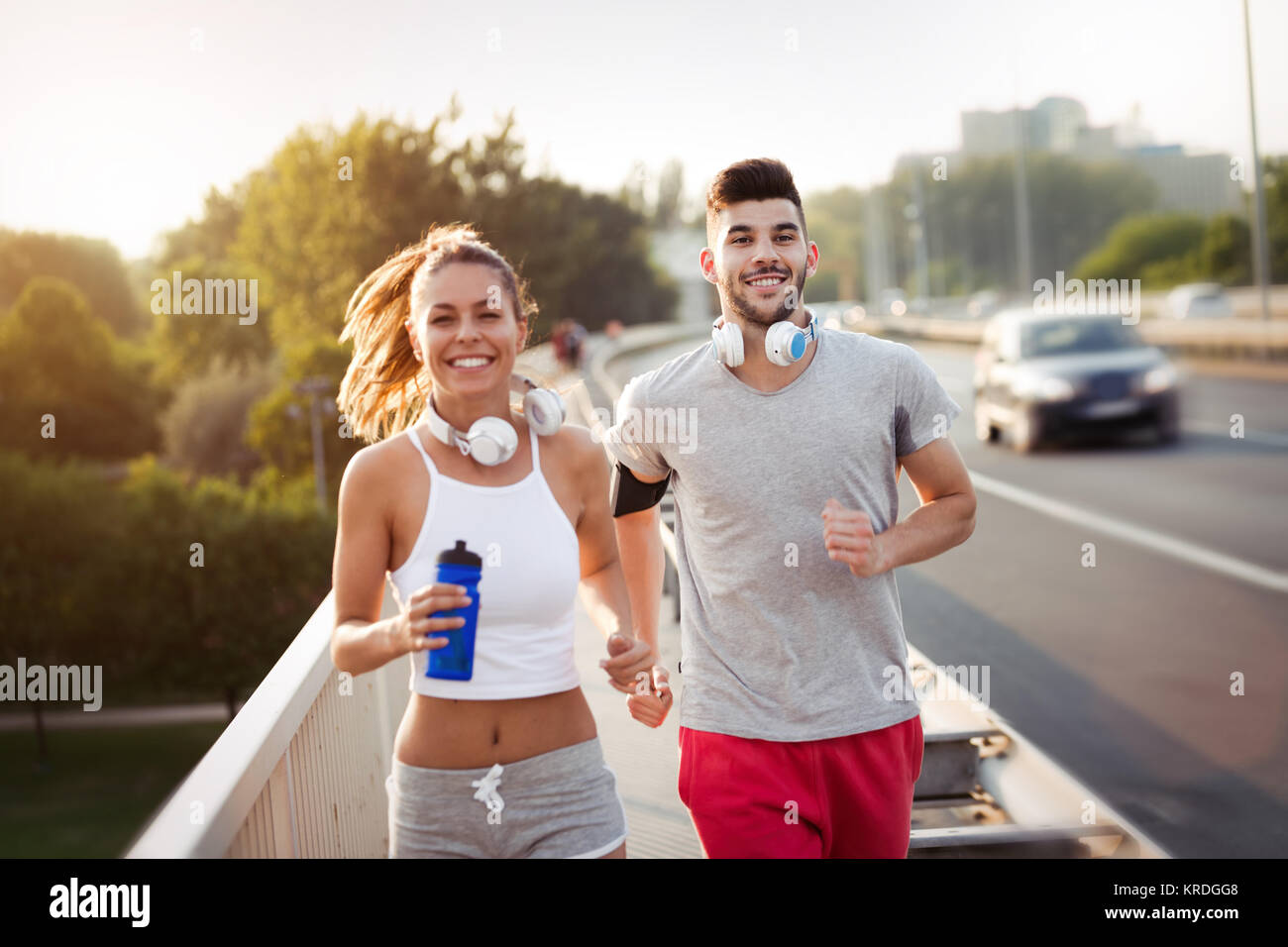 Athletic couple jogging together Stock Photo - Alamy