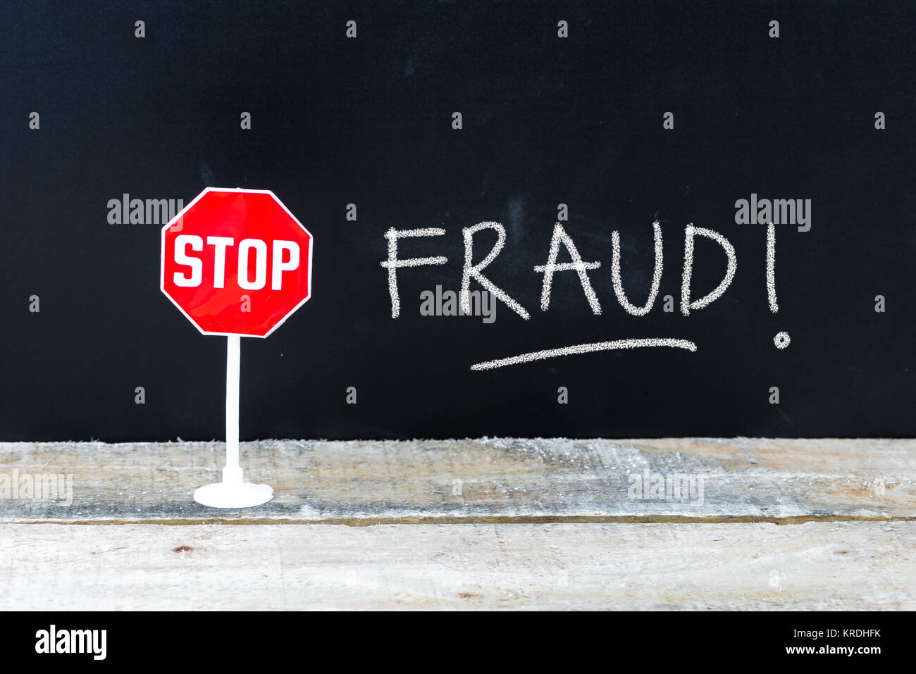 STOP FRAUD message written on chalkboard Stock Photo - Alamy