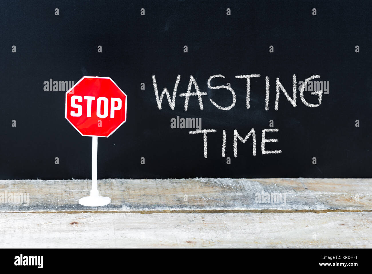 STOP WASTING TIME message written on chalkboard Stock Photo - Alamy