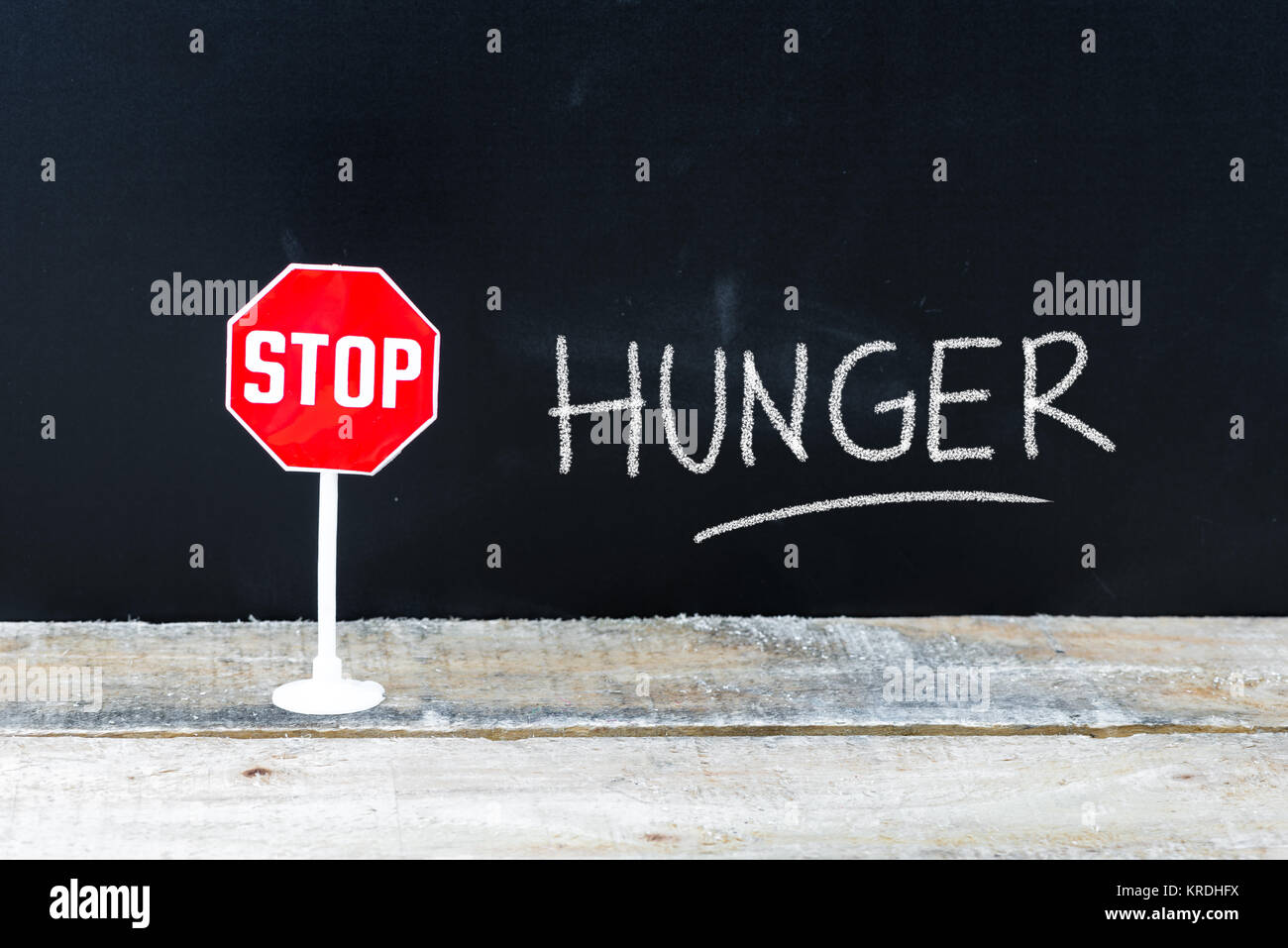 STOP HUNGER message written on chalkboard Stock Photo - Alamy