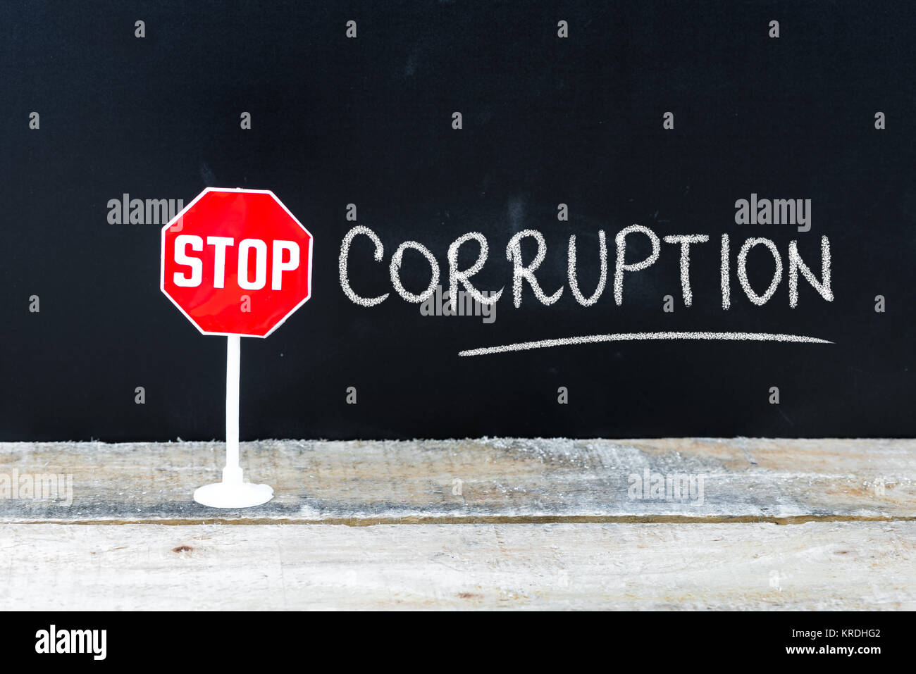 STOP CORRUPTION message written on chalkboard Stock Photo - Alamy