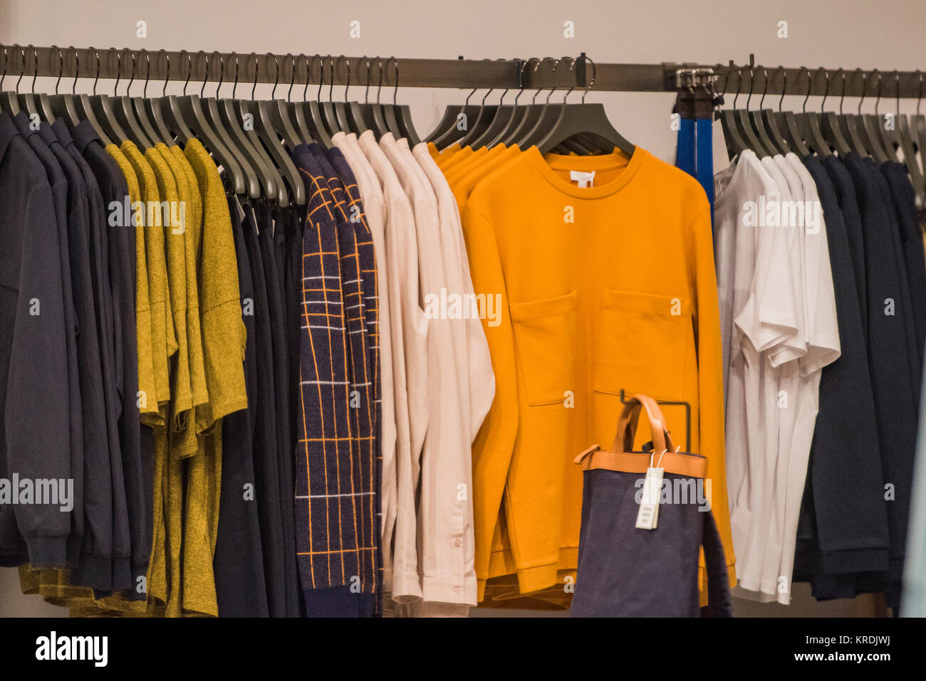Women clothing on racks in a fashion store Stock Photo - Alamy