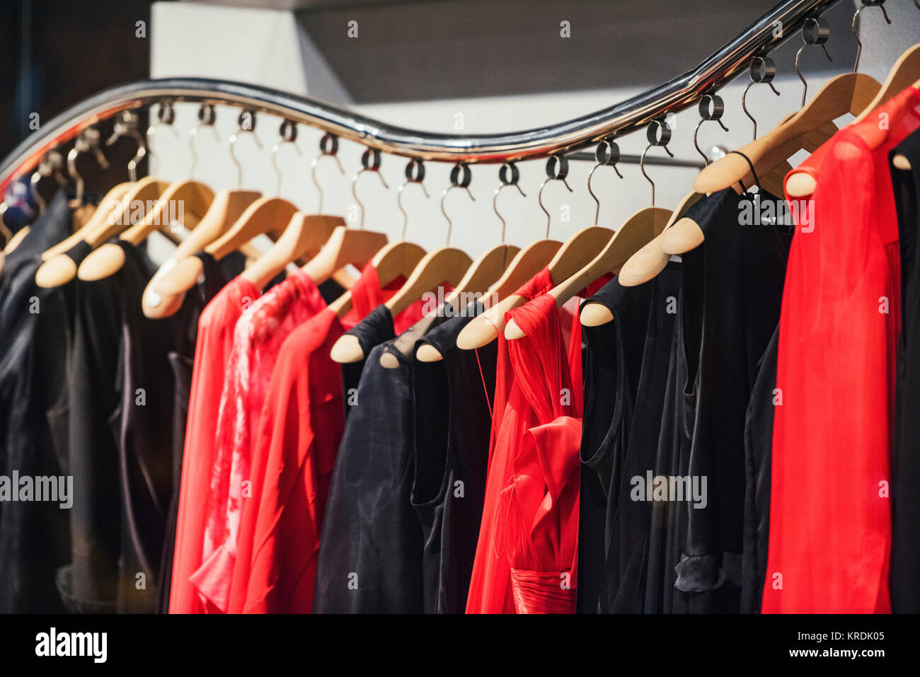 Women clothing on racks in a fashion store Stock Photo - Alamy