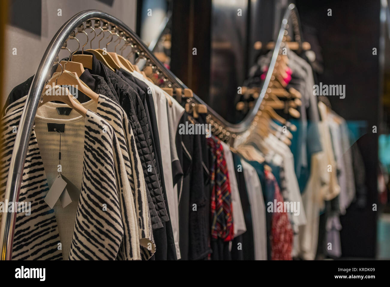 Women clothing on racks in a fashion store Stock Photo - Alamy